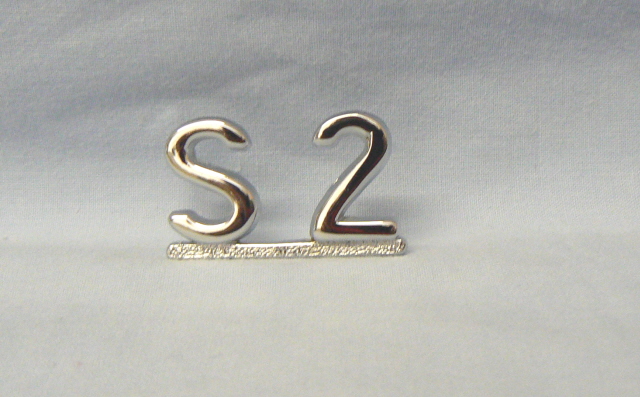 X026B0280Z BADGE, S2 (Script)